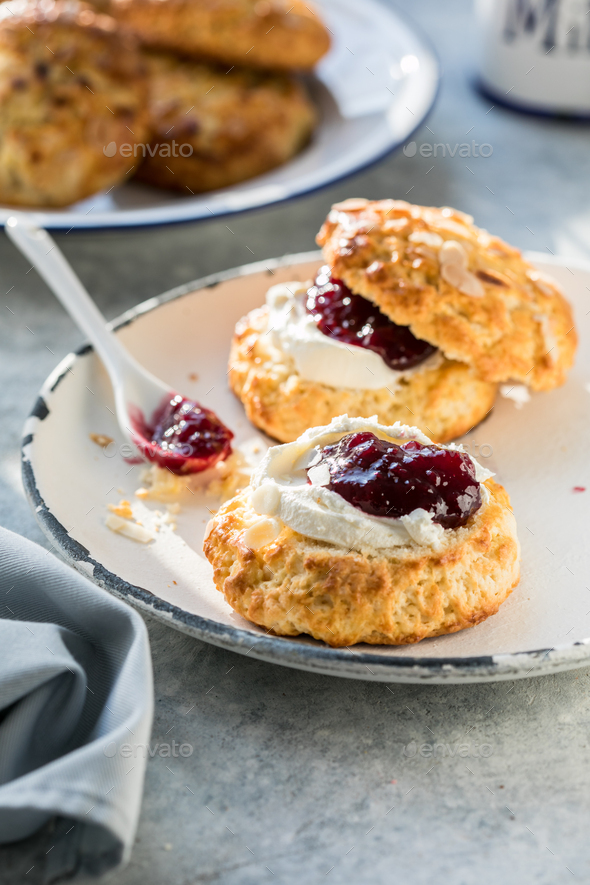Traditional British Scones with clotted cream, raspberry jam. Stock ...