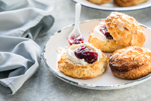 Traditional British Scones with clotted cream, raspberry jam. Stock ...