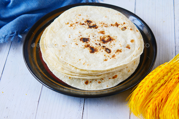 homemade roti chapati on table . Stock Photo by towfiqu98 | PhotoDune