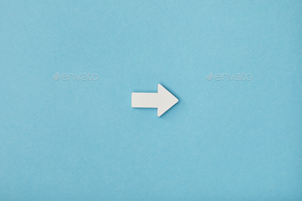 top view of white horizontal pointer on blue background Stock Photo by ...