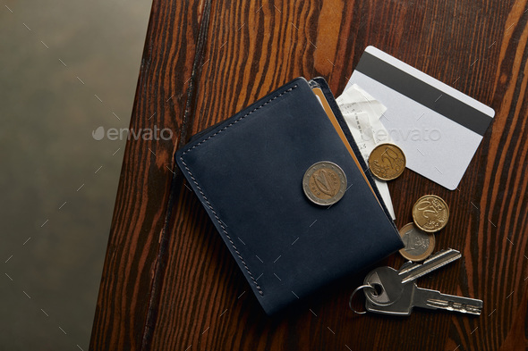 top view of wallet with credit card, coins, cheque and keys Stock Photo ...