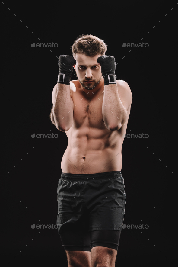 muscular strong shirtless mma fighter in stance isolated on black Stock ...