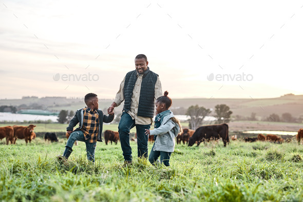 Shot of an adorable brother and sister having fun with their father on ...