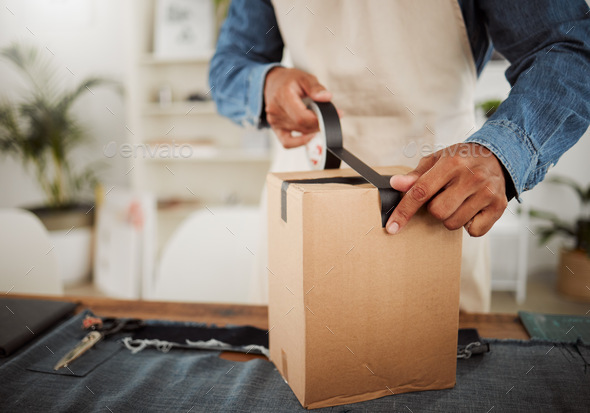 Packing parcel, package or delivery order with black tape while ...