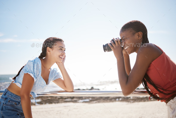 Summer, photographer and friends at a beach, having fun and posing for ...