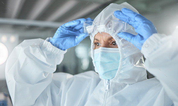 Covid, science ppe and innovation scientist with glasses and face mask ...