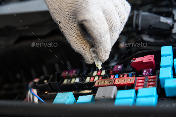 Close up photo of worker checking parts of automobile Stock Photo by ...