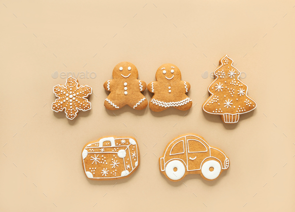 Happy New Year composition, gingerbread man and woman, suitcase and car ...