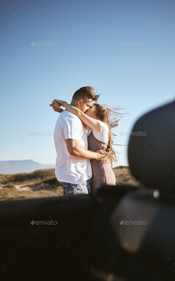 Road trip, travel and couple kiss and hug for holiday, vacation or ...