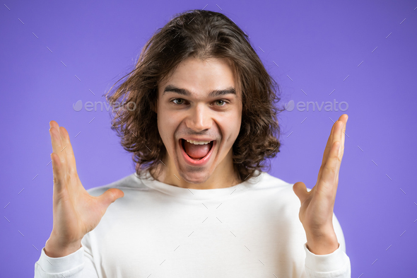 Man depicts amazement, shows WOW delight face effect. Surprised excited ...