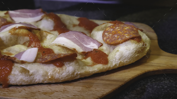 Chef putting slices of ham on pizza. Frame. Close-up cooking juicy ...