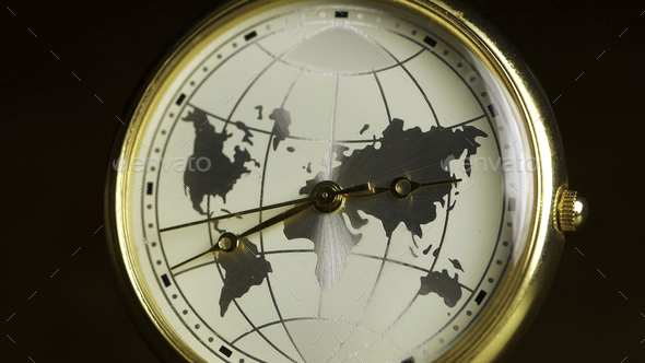 Clock with a picture of planet earth. A concept work of the world with ...