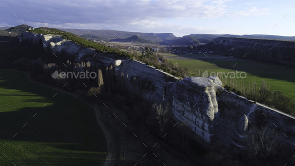 Aerial view of stunning natural stone wall, high and long cliff with ...