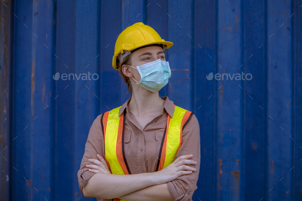 Portrait woman dock worker under working and checking production ...