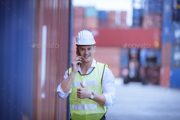 Portrait happy engineer dock worker under working and checking ...