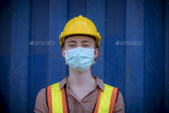 Portrait woman dock worker under working and checking production ...