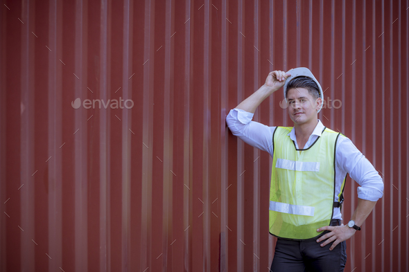 Portrait happy engineer dock worker under working and checking ...