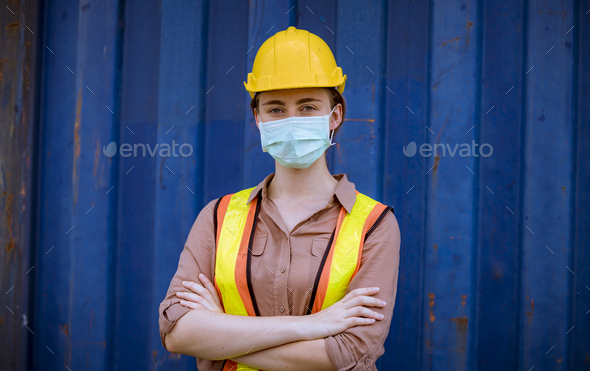 Portrait woman dock worker under working and checking production ...