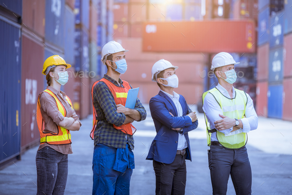 Portrait team dock workers posing under working and checking production ...