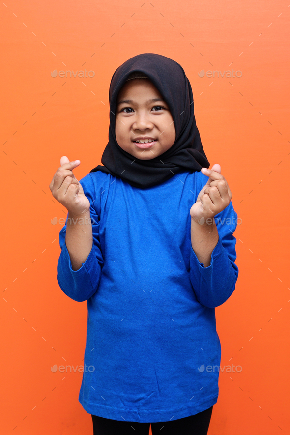 Muslim kid girl showing love finger gesture Stock Photo by Queenmoonlite35