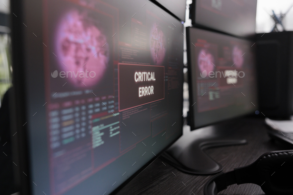 Multiple monitors showing critical error message after cyber crime ...
