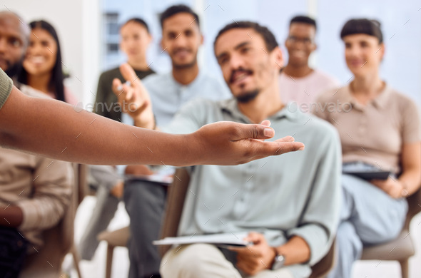 Shot of an unrecognizable person delivering a presentation to a group ...