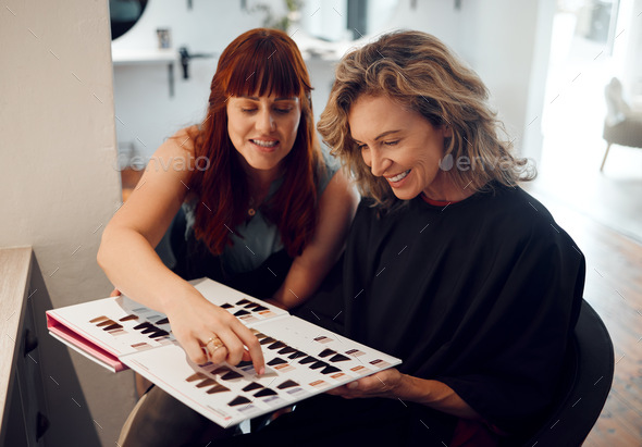 Hair salon, color catalog and consultation with woman client ...