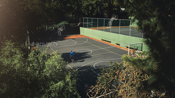 Drone, aerial view of basketball court and basketball player man ...