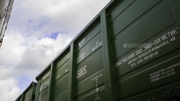Railway goods wagon and blue sky timelapse. Panoramic view of Container ...