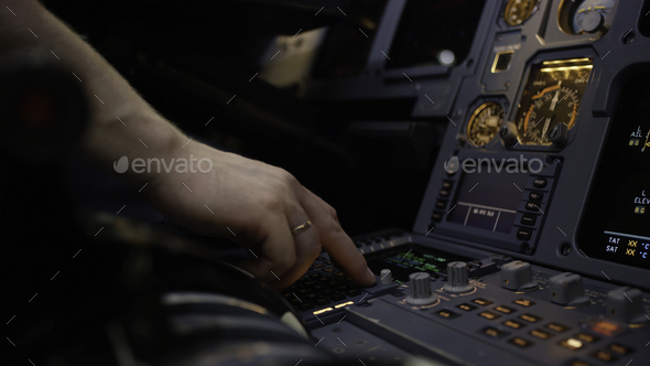 Panel of switches on an aircraft flight deck. Autopilot control element ...