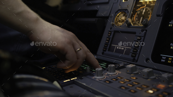 Panel of switches on an aircraft flight deck. Autopilot control element ...