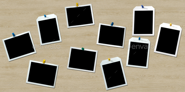 Instant frames hang on wall with colored pins Stock Photo by pbombaert