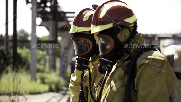 Workflow. Gas mask. Clip. Men in gas masks in the working environment ...