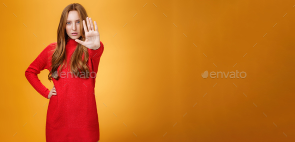 Confident sensual and attractive redhead female with self-assured gaze ...