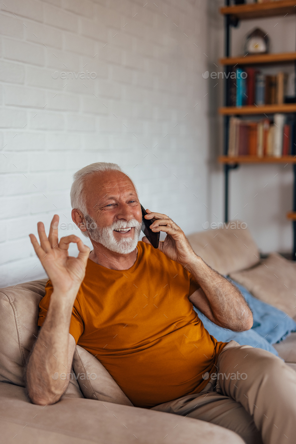 Senior man, making hand gestures, while calling his partner. Stock ...