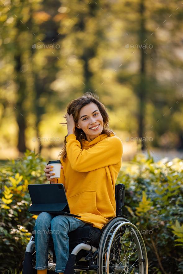 Disabled adult woman, getting ready for the picture. Stock Photo by bnenin