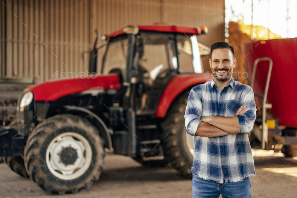 Adult man, showing off his tractor. Stock Photo by bnenin | PhotoDune