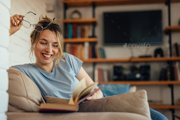 Adult woman, taking a break from reading. Stock Photo by bnenin | PhotoDune