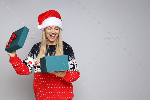 Concept of Christmas gift, young woman look in to box Stock Photo by ...