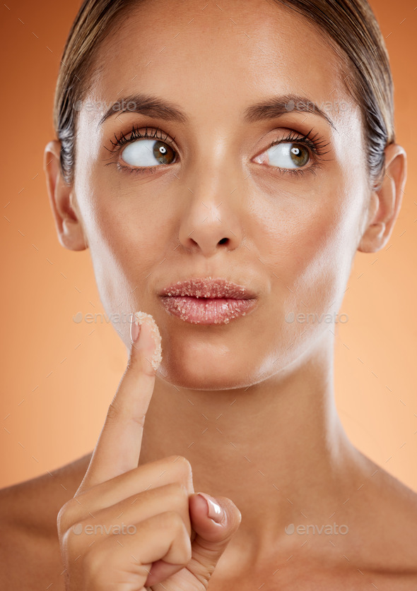 Face, beauty and idea with a model woman applying sugar lip balm her ...