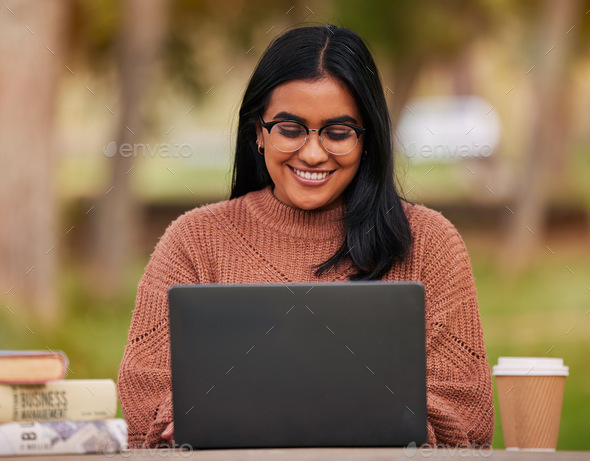 University, laptop and student studying on campus outdoor research ...