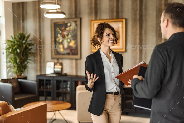 Explaining something to her boss. Stock Photo by bnenin | PhotoDune