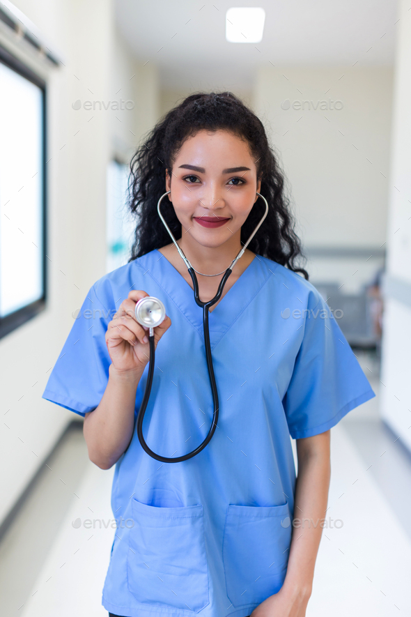 Doctor at hospital. Friendly doctor dressed in uniform with stethoscope ...