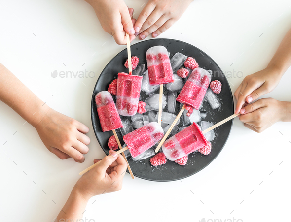 Children's hands take the ice cream Stock Photo by tan4ikk | PhotoDune