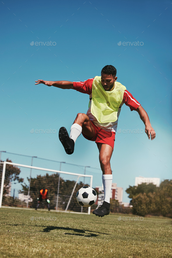 Sport, fitness and soccer training with soccer player in soccer ball ...