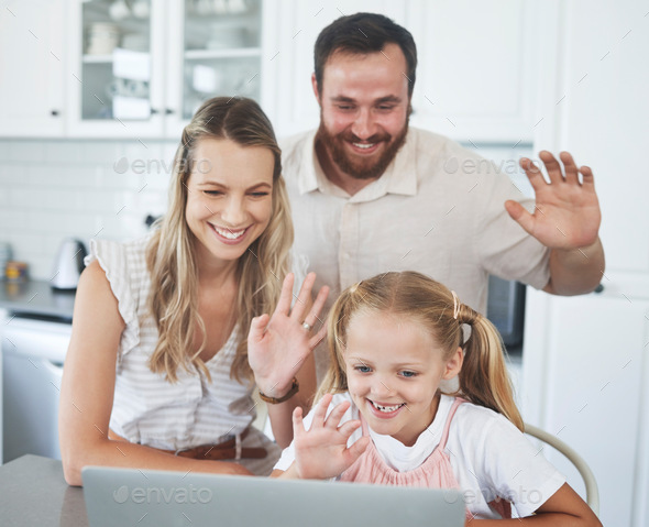 Happy family, wave and video call on laptop in kitchen with friends ...