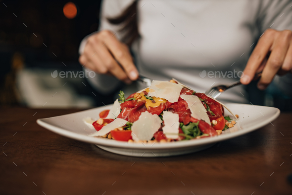 Healthy eating, using fork and knife. Stock Photo by bnenin | PhotoDune