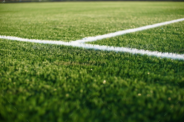 green synthetic grass surface on a soccer ground, european football ...