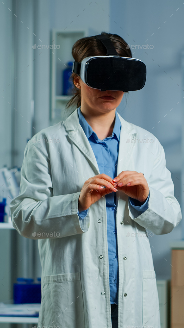 Neurological scientist using medical inovation in lab wearing VR ...