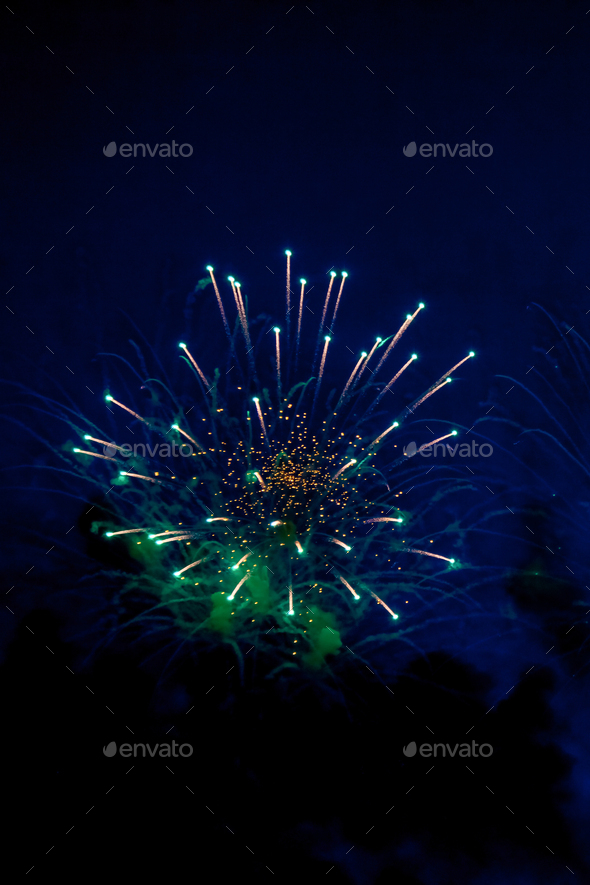Fireworks with sparks, colored stars and bright nebula on black night ...